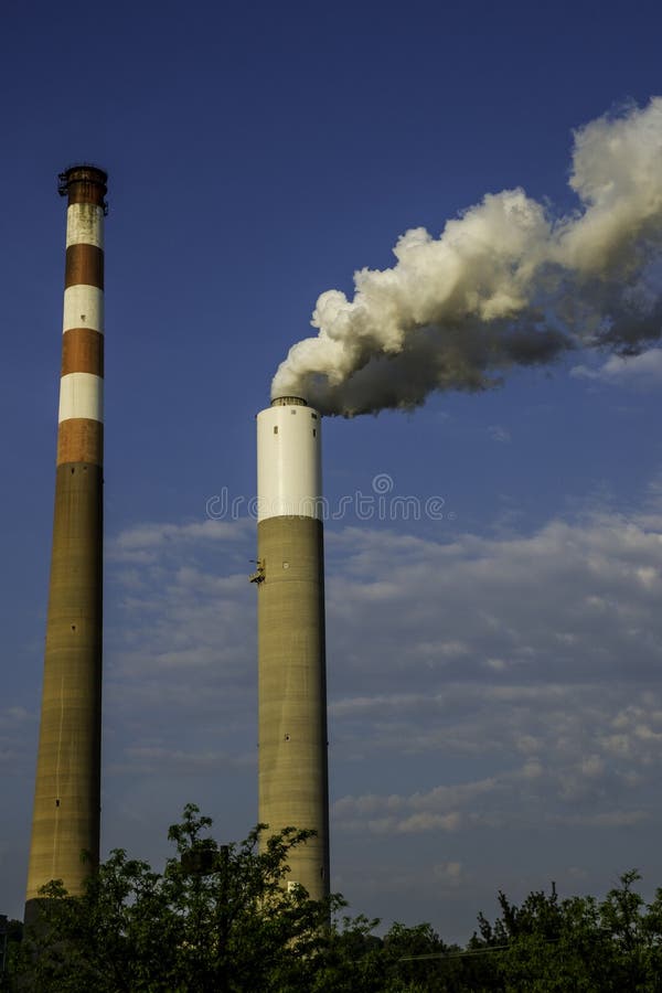 Two Smoke Stacks stock photo. Image of stacks, smoke - 104879216