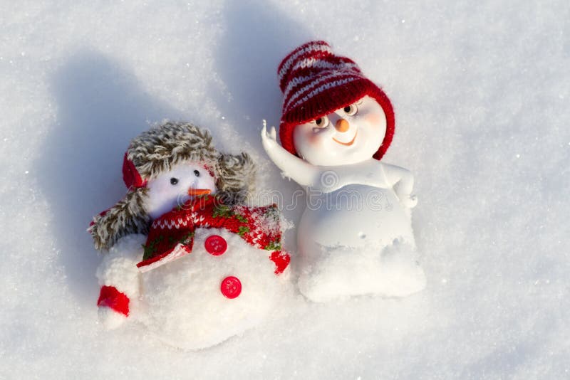 Two Snowman Lying on the Snow Stock Image - Image of outdoors, girl ...