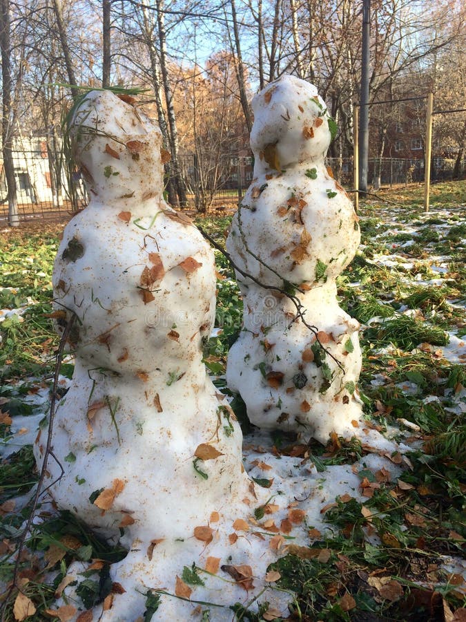 Two snowmen in autumn stock image. Image of winter, branch - 46232841