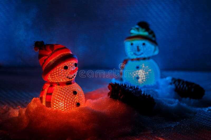 Two snowmen at night stock image. Image of reflection - 83215563