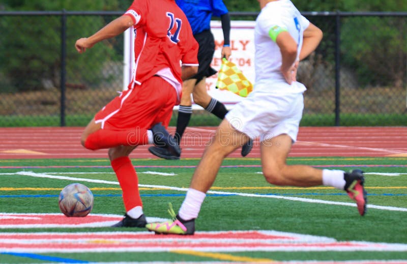 Two Soccer Players Chasing the Ball during a Game Stock Photo - Image ...