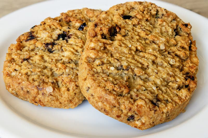 Two Soft Flaky Cookies on a White Plate Stock Photo - Image of grains ...
