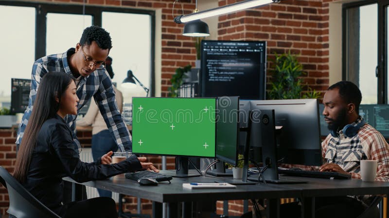 Two Software Developers Analyzing Source Code Looking At Green Screen Chroma Key Mockup With