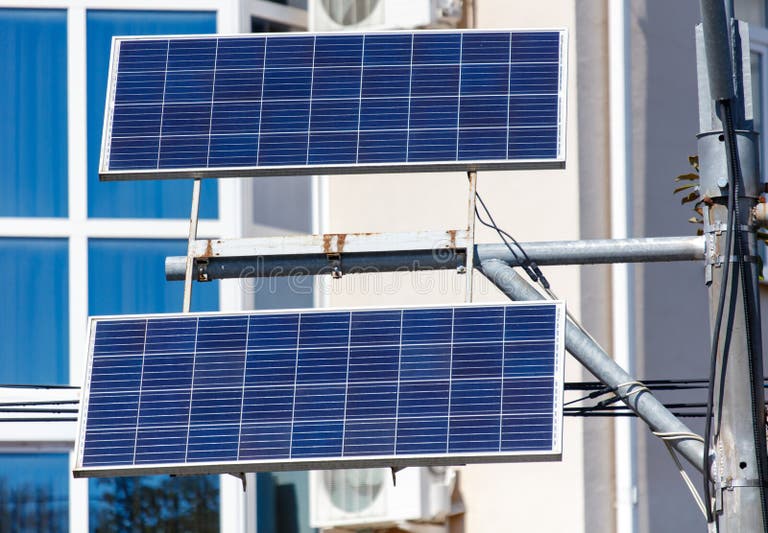 Two Solar Panels are Attached To a Pole Stock Image - Image of cell ...