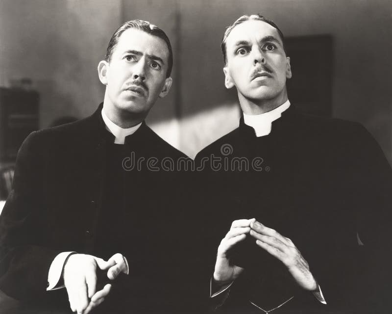 Two solemn priests stock photo. Image of front, adults - 77560844