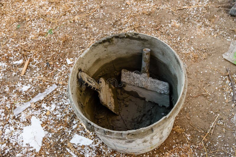 Two Spatulas in Bucket with the Mortar Stock Photo - Image of finishing ...