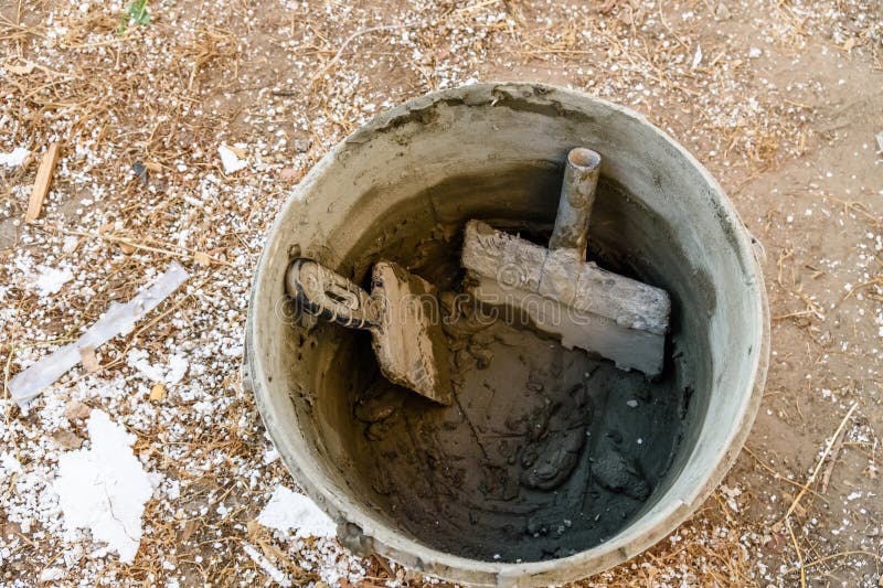 Two Spatulas in Bucket with the Mortar Stock Photo - Image of closeup ...