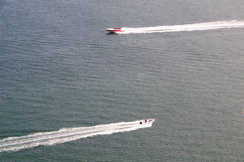 Two Speed Boats Passing stock photo. Image of passengers - 98773144