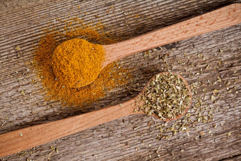 Two Spices in Wooden Spoons Stock Photo - Image of seasoning, oregano ...