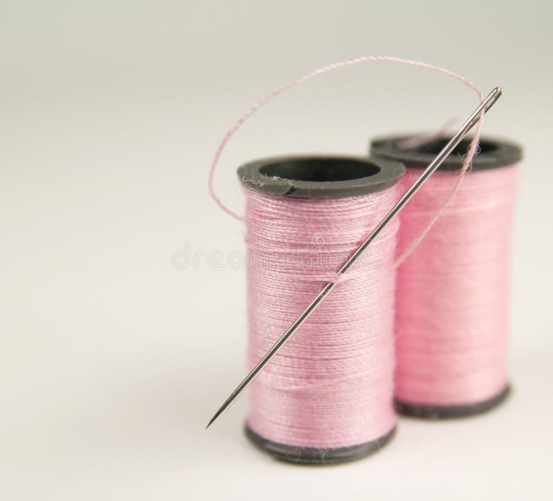 Two Spools of Pink Thread with Needle Stock Photo - Image of point ...