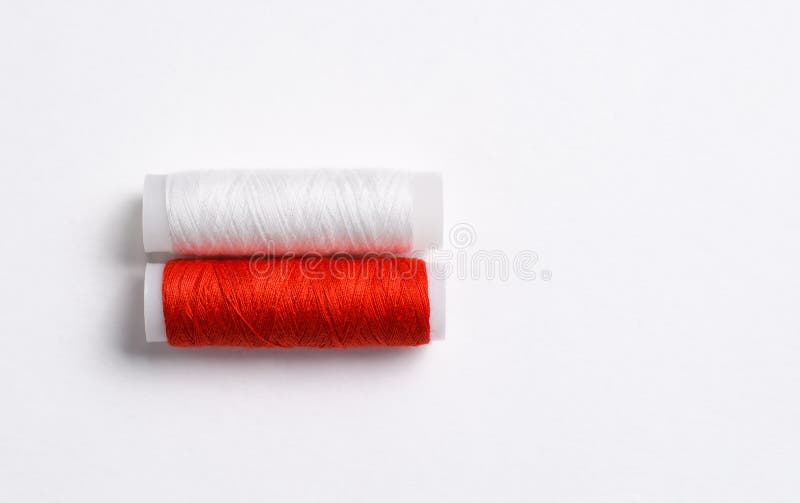 Two Spools of Thread for Sewing are Stacked in the Form of the Flag of ...