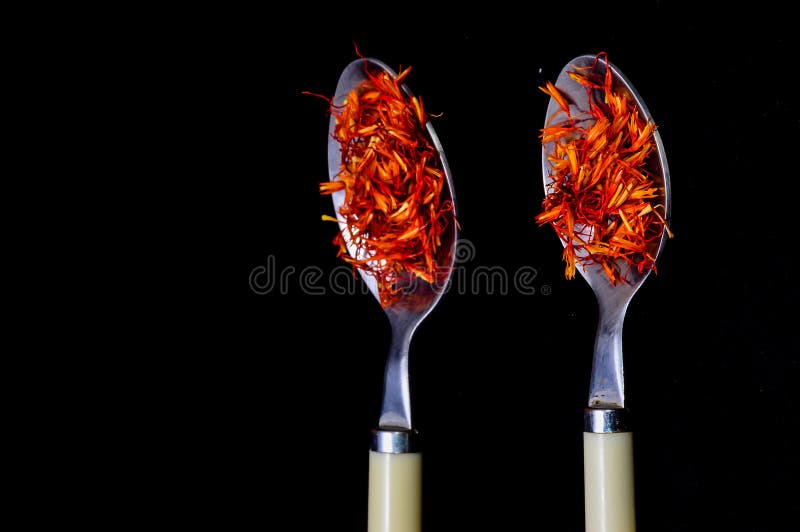 Two Spoons with Orange Powder on Them Stock Photo - Image of flame ...