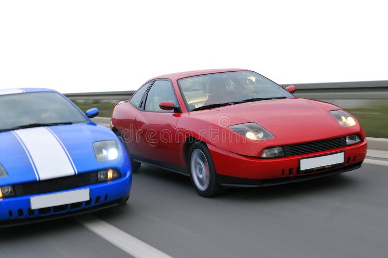 Two Sport Car Racing on the Highway Stock Photo - Image of expensive ...