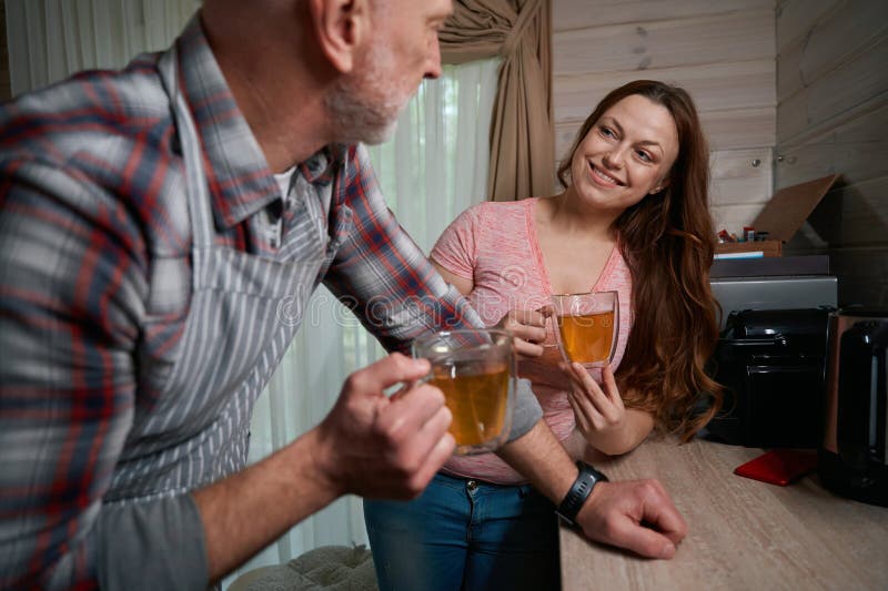Married Couple Communicating in Kitchen Over Tea Stock Image - Image of ...