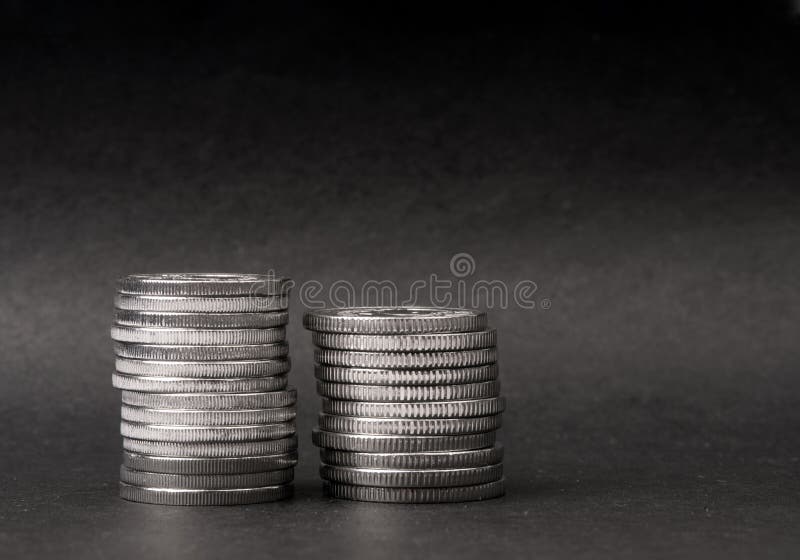 Two Stacks of Coins on a Black Stock Image - Image of coins, money ...