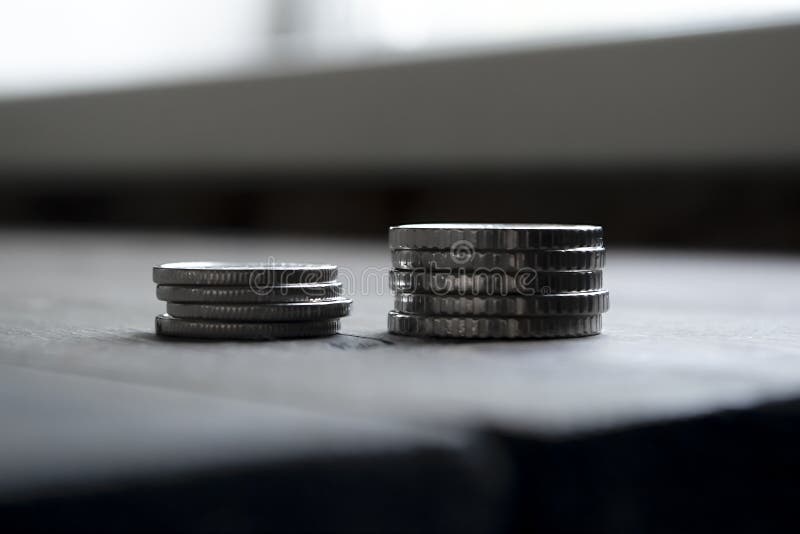 Two Stacks of Coins on a Wooden Table. Coins Side Macro Shooting. Money ...