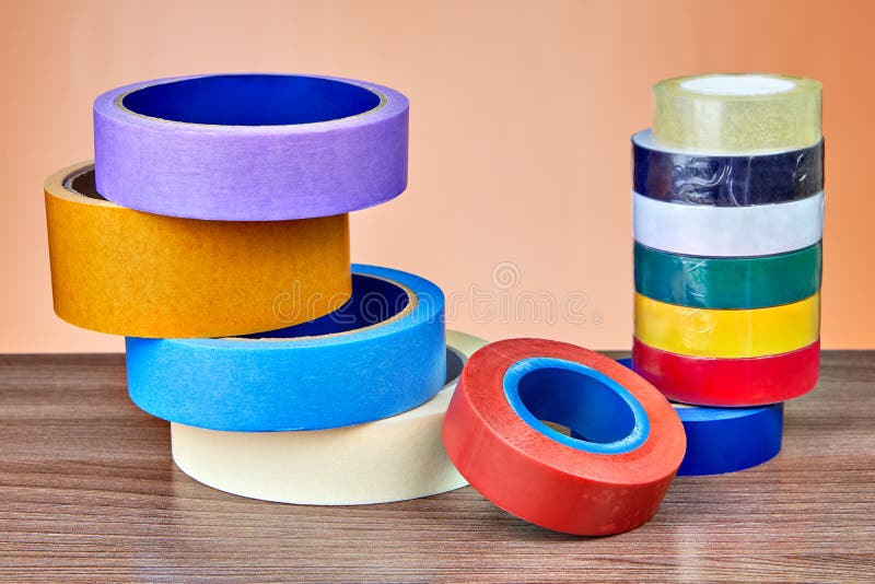 Two Stacks of Rolls of Multi-colored Adhesive Tape. Stock Image - Image ...