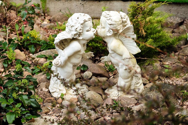 Two Statues of Angels in the Garden Stock Image - Image of face, hotel ...