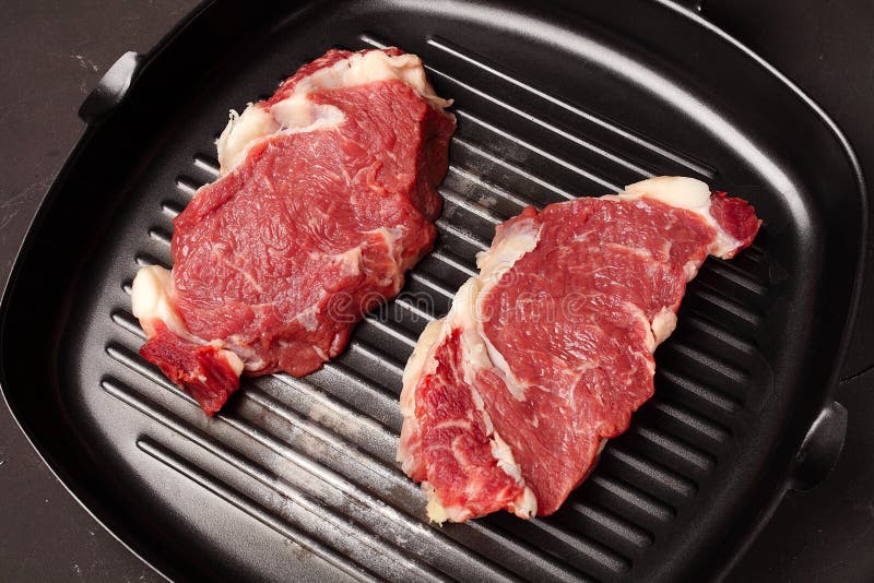 Two Steaks in a Pan for Grilling Stock Image - Image of sirloin, steaks ...