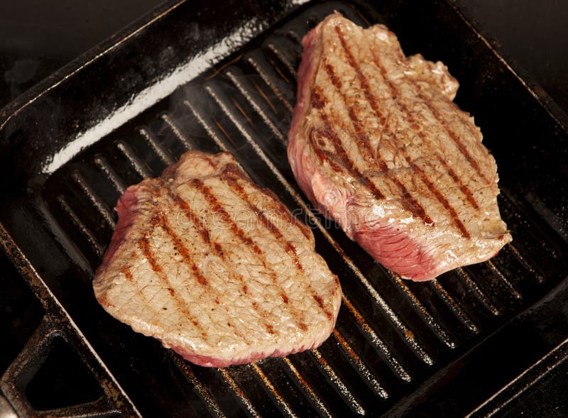 Two steaks in the pan stock image. Image of healthy, beef - 46550863