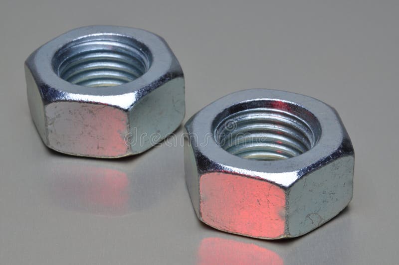 Two steel nuts stock photo. Image of shiny, stainless - 48801684