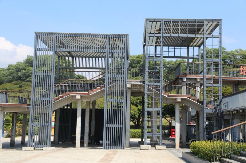 Two Steel Structures, One in the Shape of an Open Square and the Other ...