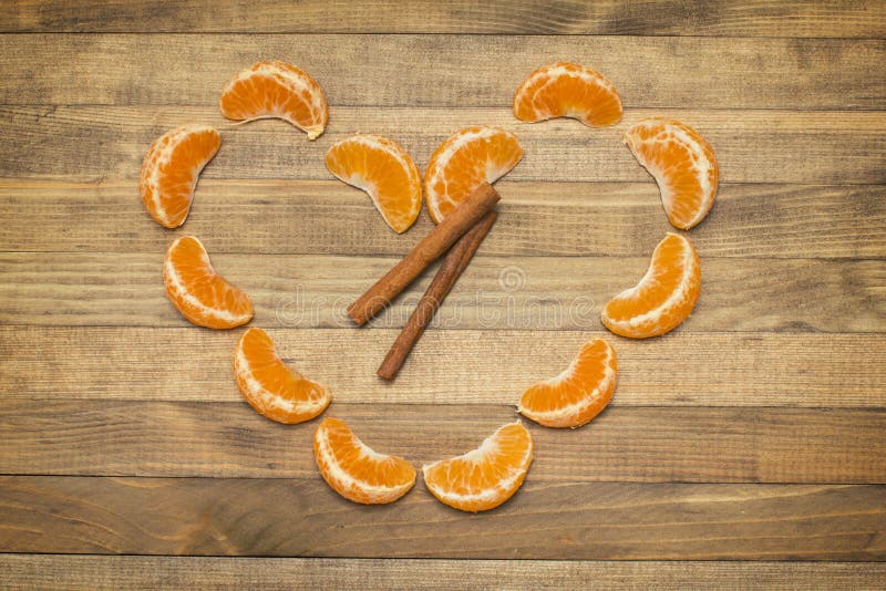 Two Stick Cinnamon and Heart Symbol Made of Mandarin Stock Photo ...