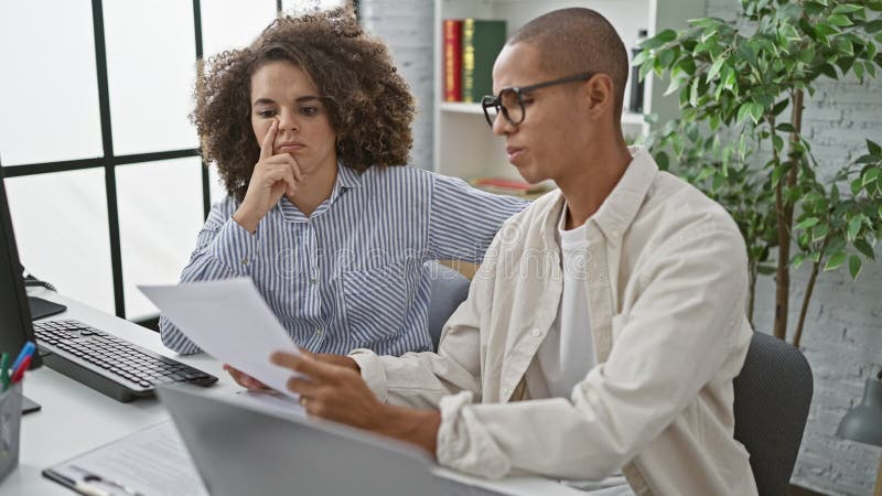 Two Stressed Coworkers, a Man and Woman, Working Together on a ...