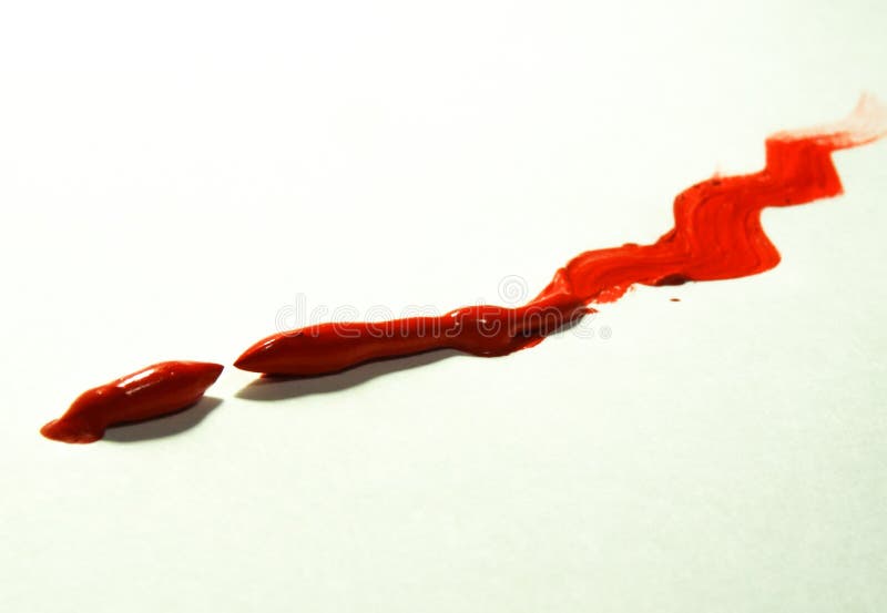 Two strips of red paint. stock photo. Image of tube - 106272790