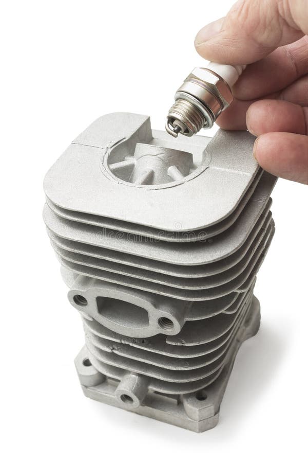 Two-stroke Engine Cylinder and Spark Plug in the Hand of a Master Stock ...