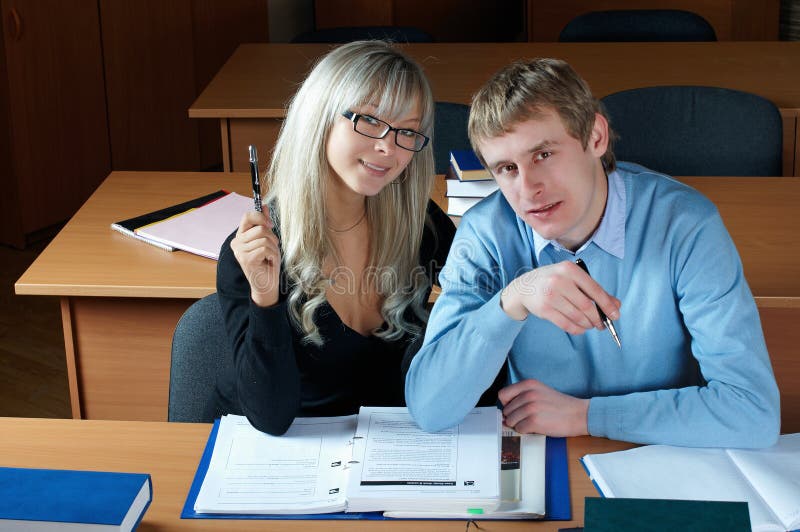 Two student in classroom stock image. Image of group - 12079475
