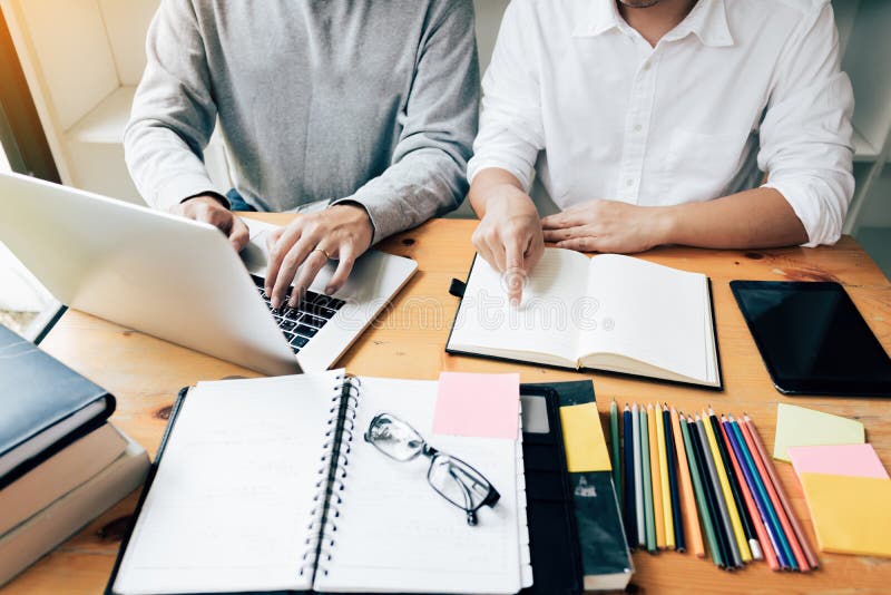 Two Student Reading Textbook for Test Together in Library Stock Photo ...