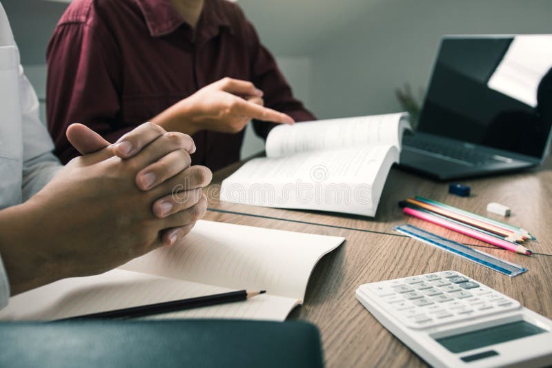 Two Student Reading Textbook for Test Together in Library Stock Image ...