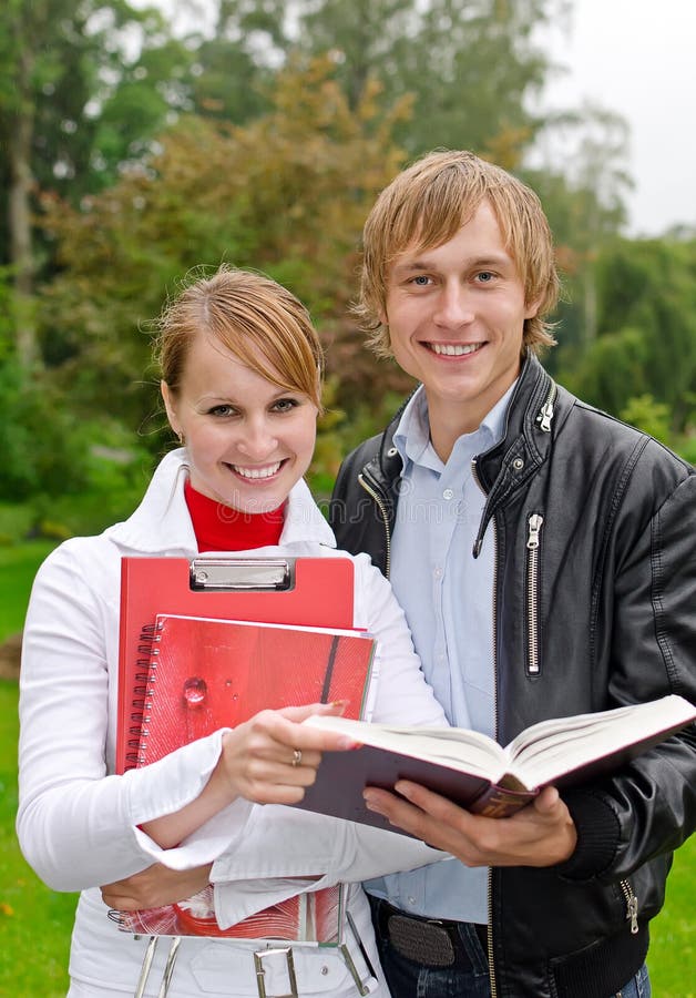 Two students stock photo. Image of outdoor, looking, notebook - 26516884
