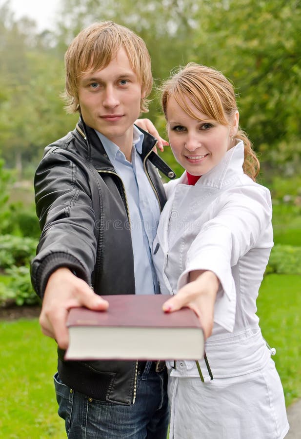 Two students with book stock image. Image of book, happy - 26516887