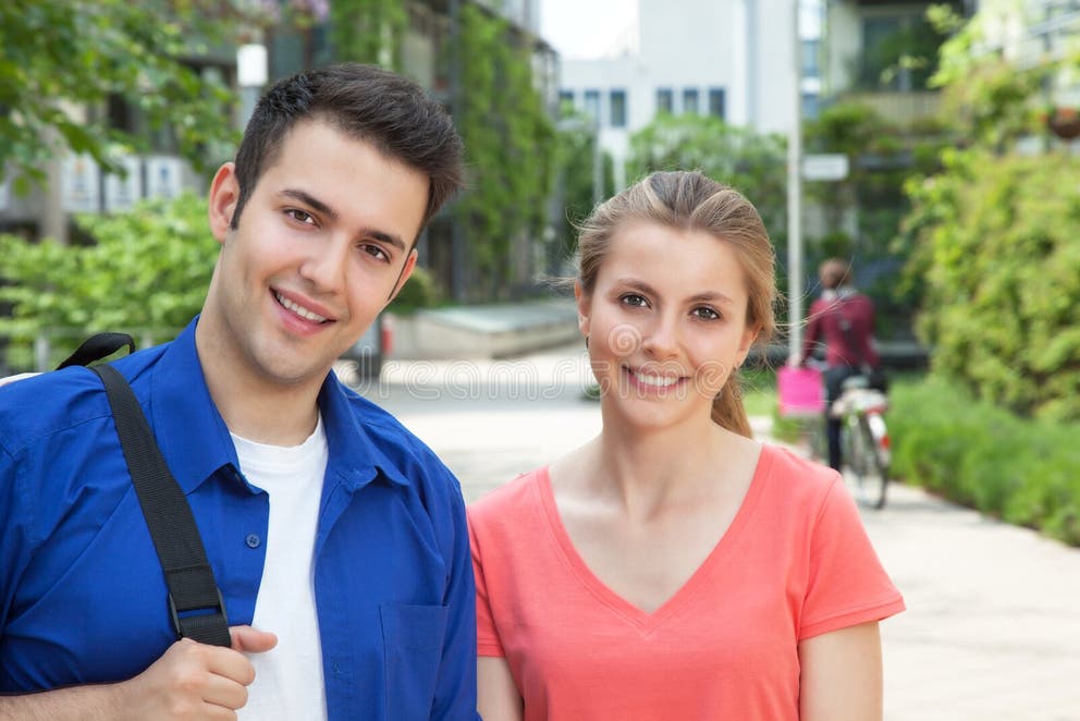 Two Students on Campus Laughing at Camera Stock Image - Image of ...