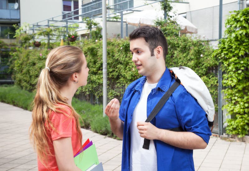 Two Students Talking on Campus Stock Photo - Image of couple, educate ...