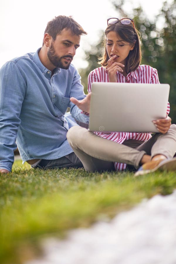 Two Students Consulting for a Paper Together Stock Image - Image of ...
