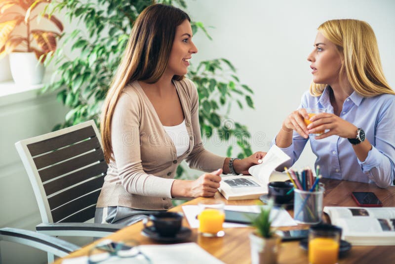 Two Students Doing Homework Together and Helping Each Other Stock Photo ...