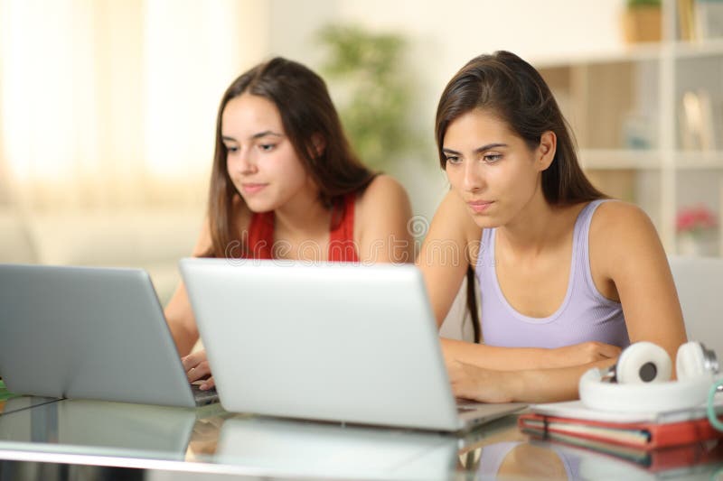 Two Students E-learning Together in a House Stock Photo - Image of study, people: 337313412