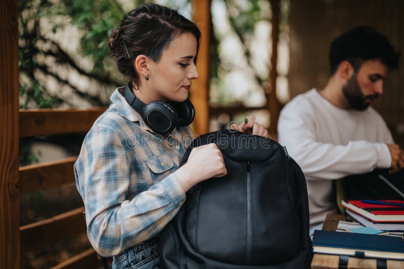 Students Studying Outdoors at a Wooden Table on Campus Stock Image ...