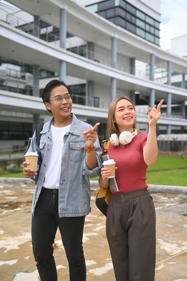 Two Students Friends Walking Outside University Building and Talking ...
