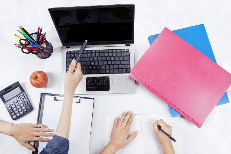 Two Students Hand Doing Homework Stock Image - Image of people, group ...