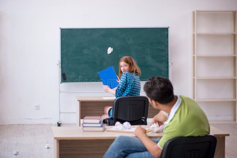 Two Students Having Fun in the Classroom Stock Photo - Image of female ...