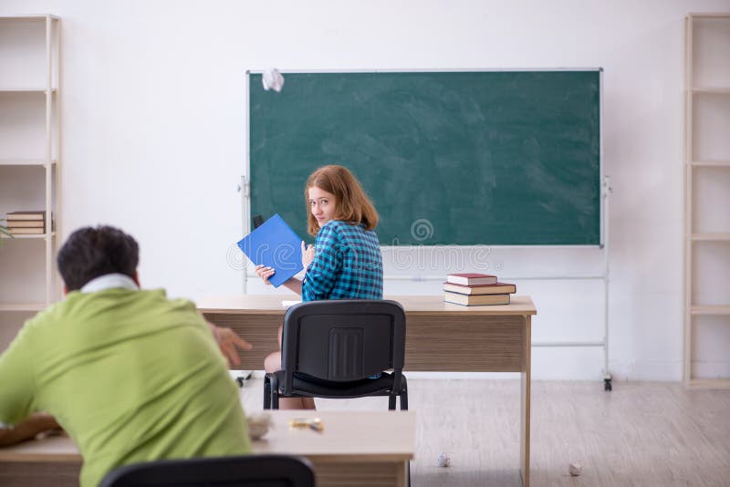 Two Students Having Fun in the Classroom Stock Image - Image of paper ...
