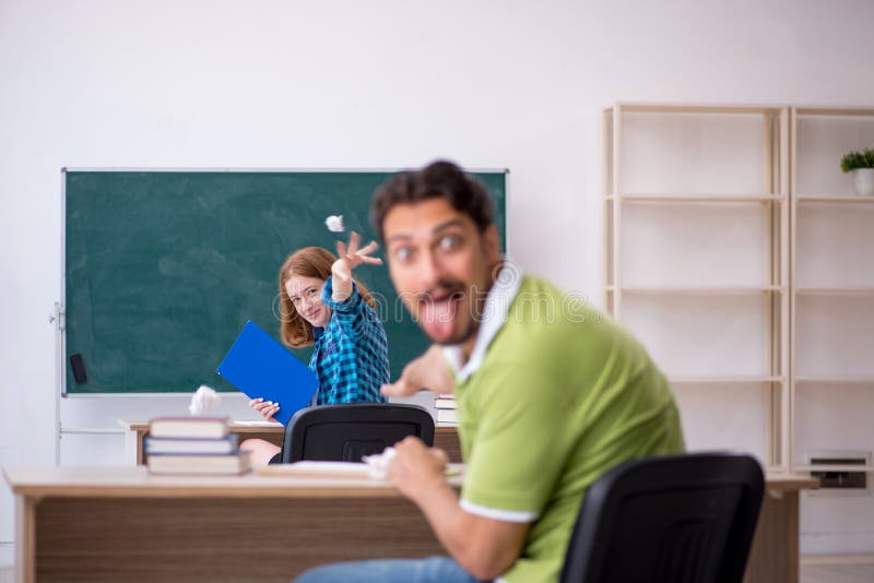 Two Students Having Fun in the Classroom Stock Image - Image of class ...