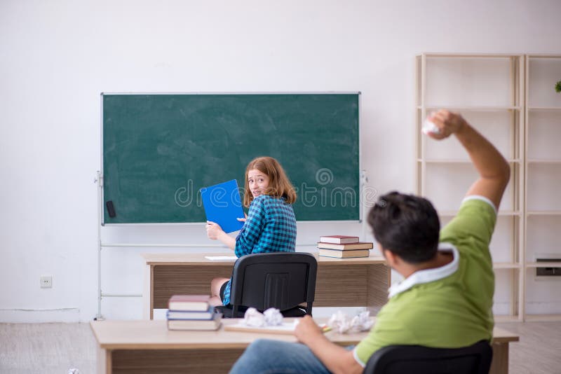 Two Students Having Fun in the Classroom Stock Photo - Image of male ...