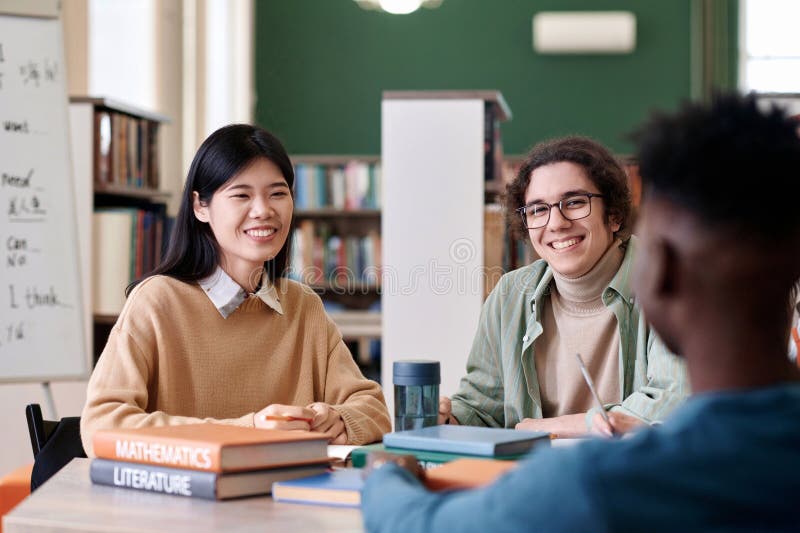 Two Students Laughing Happily in Library Stock Image - Image of desk ...