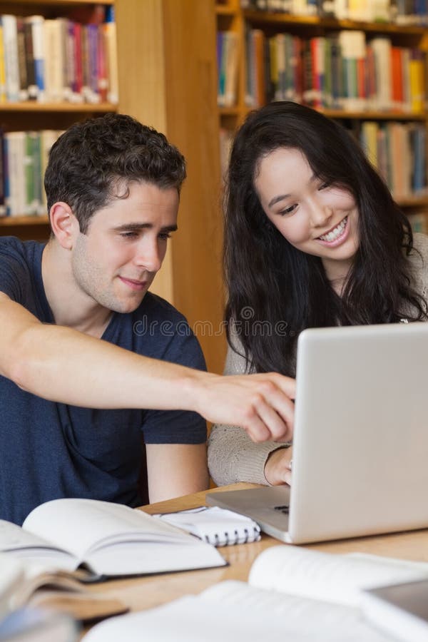 Students Learning with Laptop and Tablet in a Library Stock Image ...