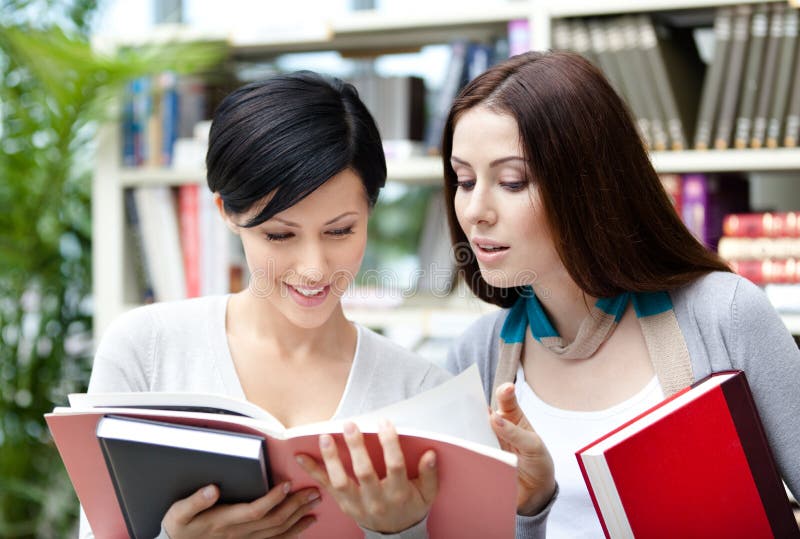 Two Students Read Books at the Library Stock Photo - Image of format ...
